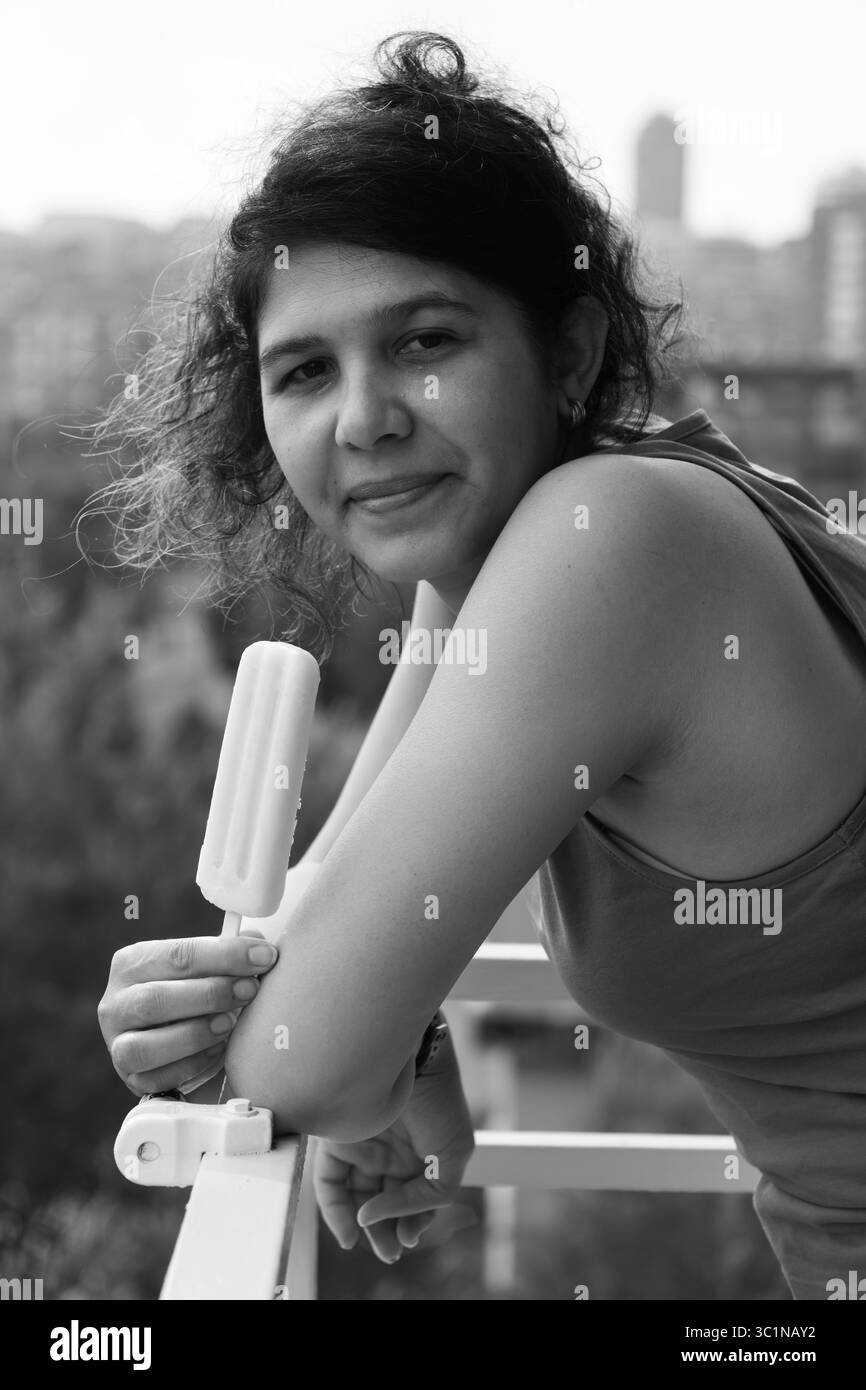 Brunette holding Black and White Stock Photos & Images - Alamy