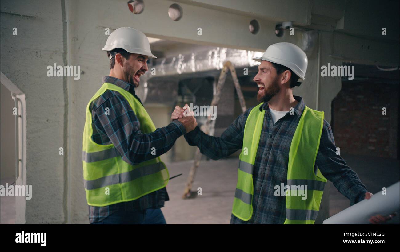Two happy Caucasian men greeting friends buddies males guys workers in ...