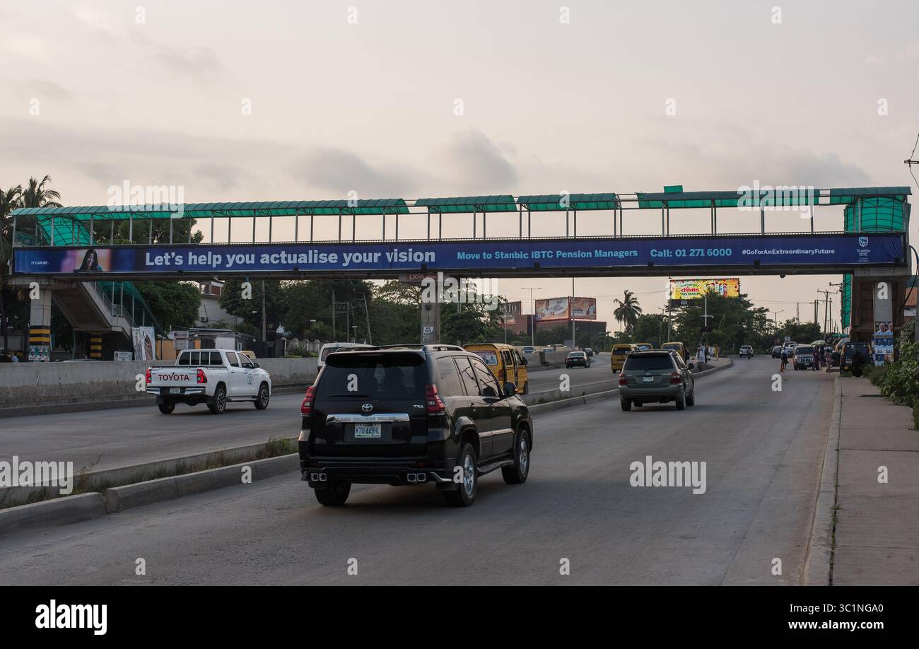 Everyday life in Lagos as traffic flows along a road in Lagos Mainland ...