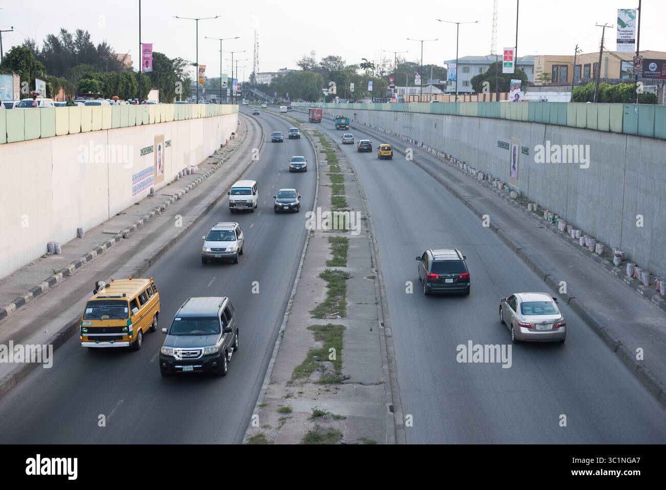 Everyday life in Lagos as traffic flows along a road in Lagos Mainland ...