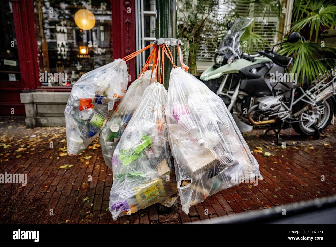 GOUDA - Garbage bags in a residential area with separated trash in ...