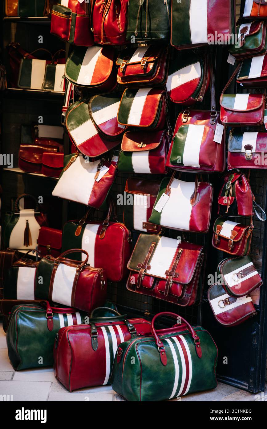 Colorful leather bags and purses with italian flag colors hanging and ...