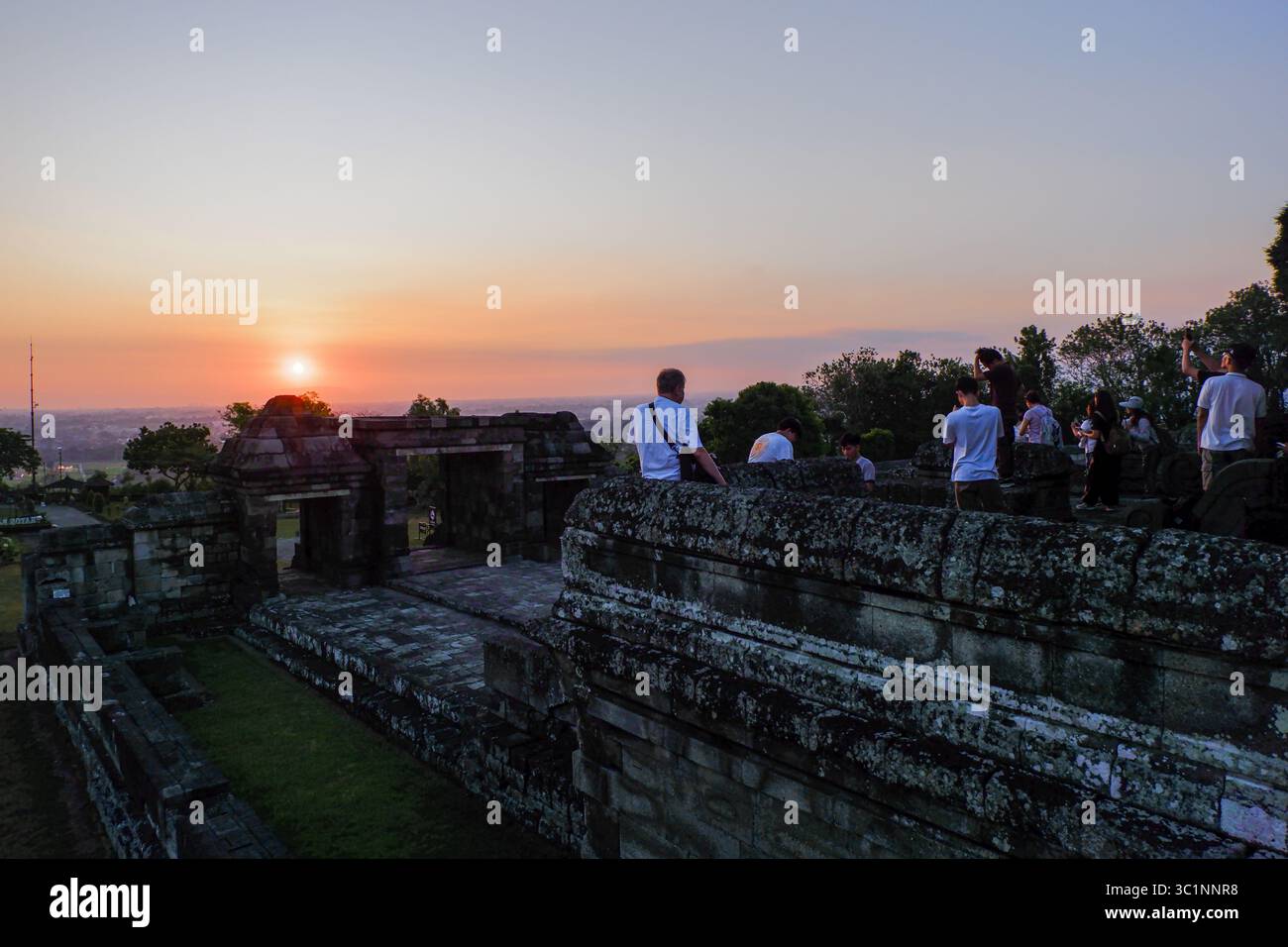 Tourist enjoy the view at Ratu Boko, an ancient hilltop archaeological ...