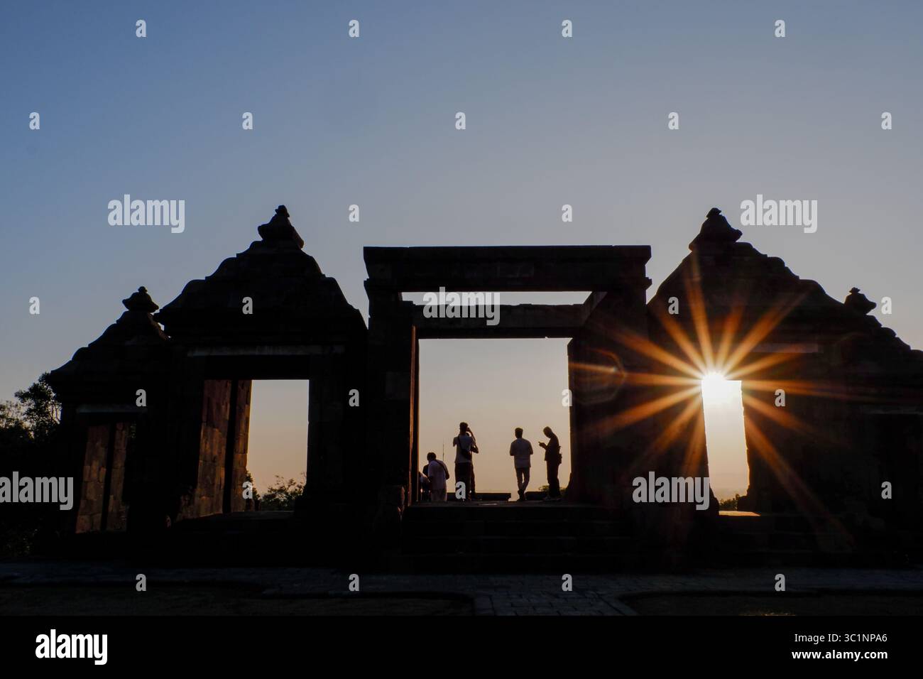 Tourist take photos at Ratu Boko, an ancient hilltop archaeological ...