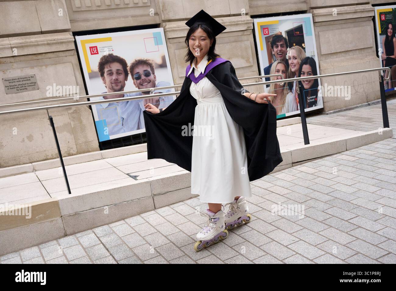 A graduand celebrating her graduation from The London School of ...