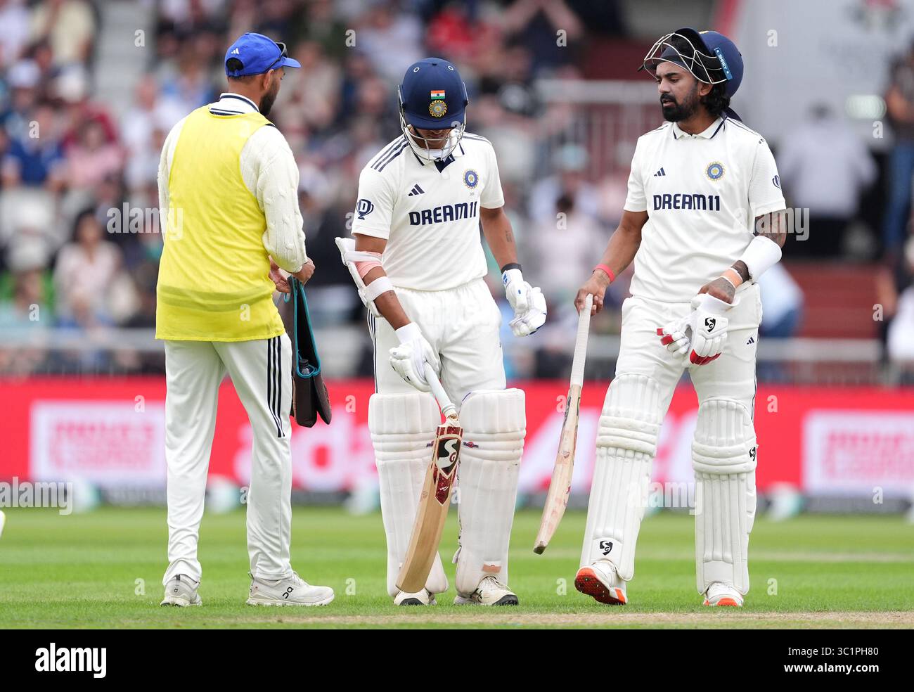 India's Yashasvi Jaiswal (centre) holds a broken bat during a stop in ...