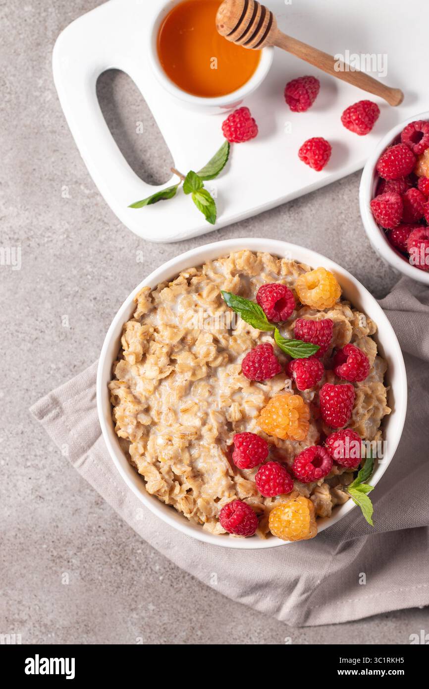 Tasty oatmeal porridge raspberries hi-res stock photography and images ...