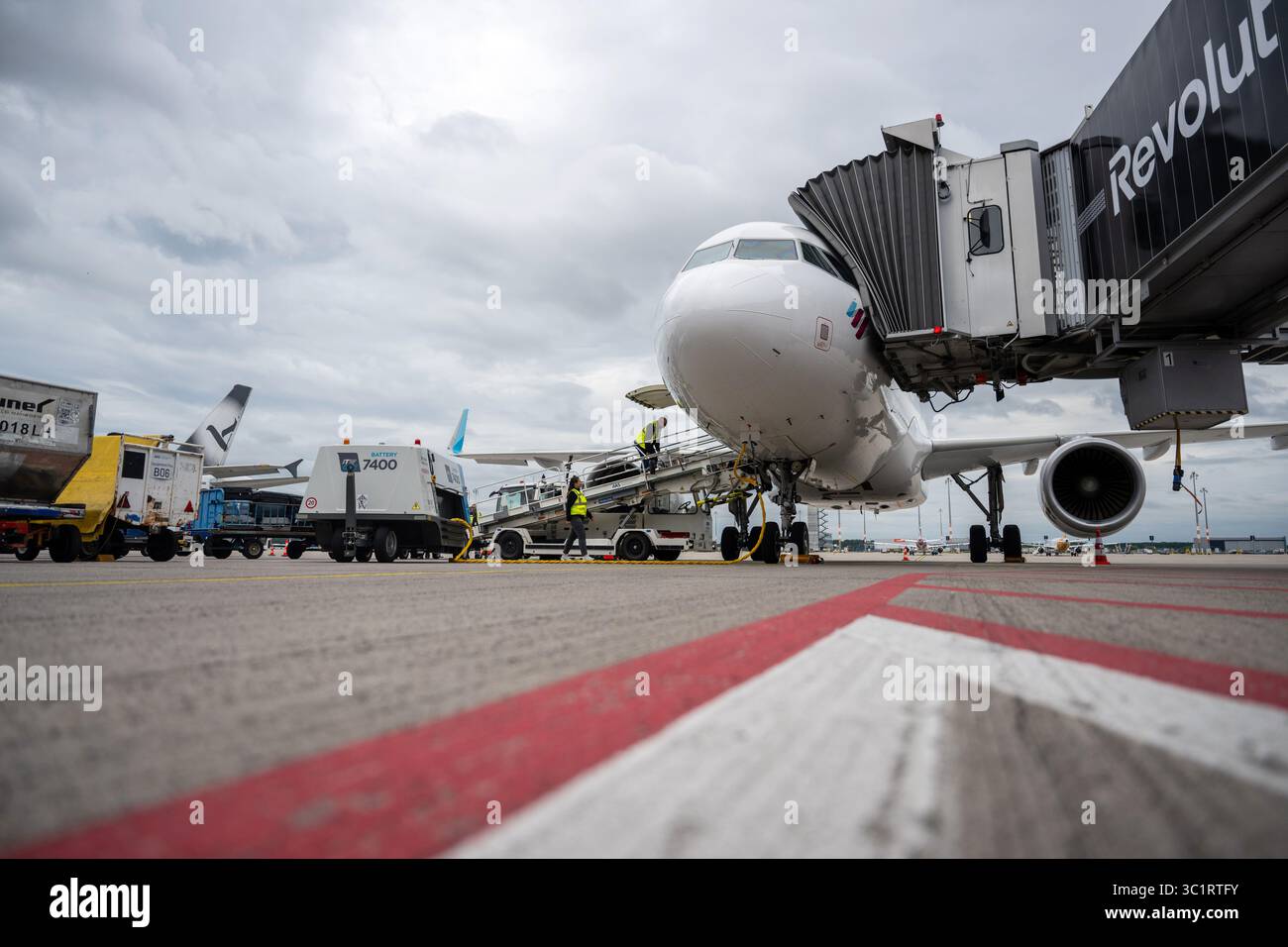 17 July 2025, Brandenburg, Schönefeld: Several ground vehicles are ...