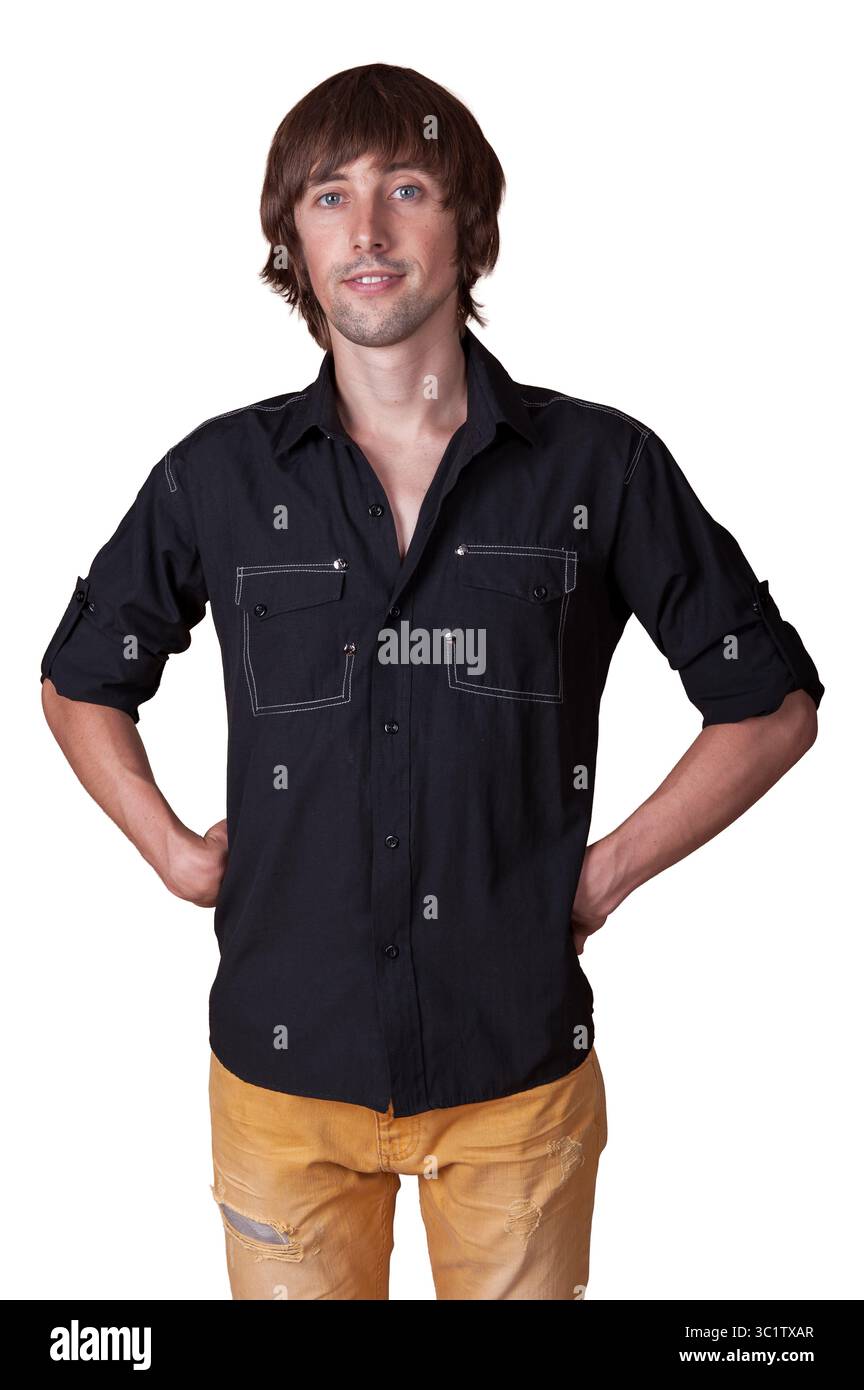 A young man stands confidently with his hands on his hips, wearing a ...