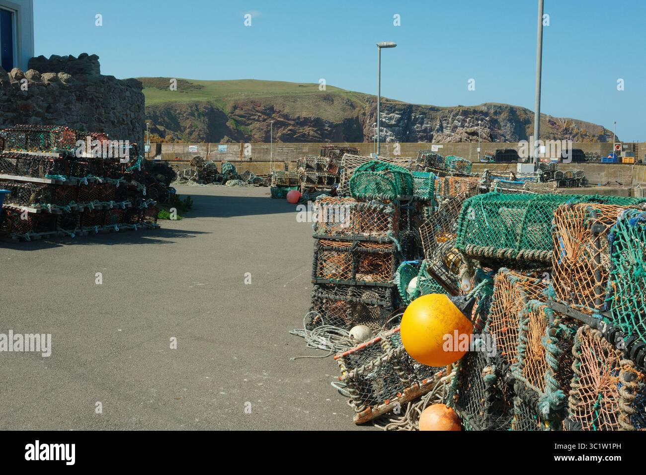 Jumble of fishing creels, piled high in Scottish fishing village Stock ...