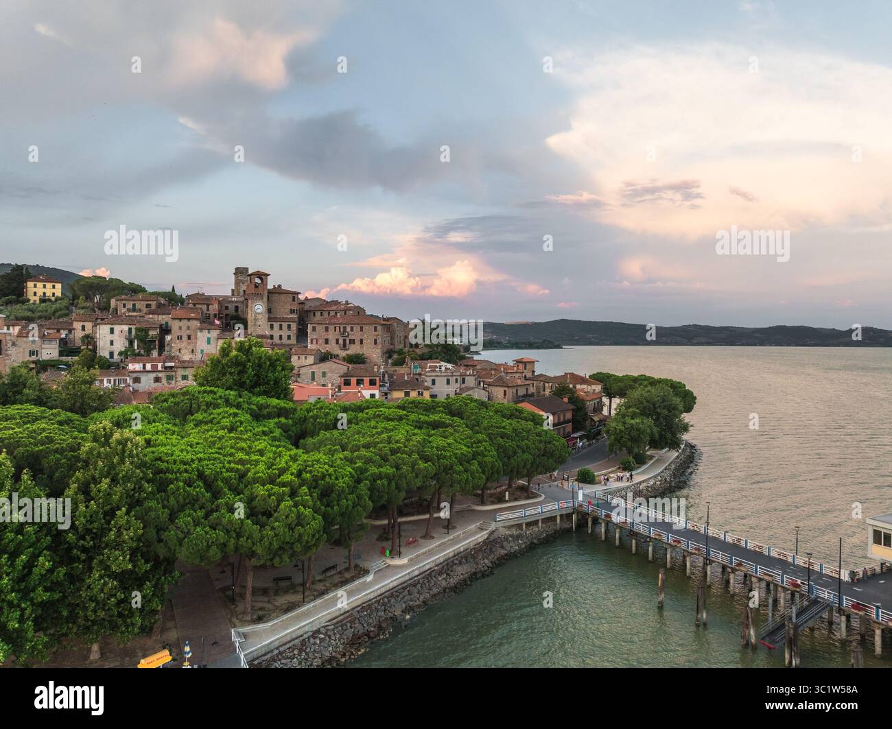 Aerial view of a charming town with ancient stone buildings, a pier ...