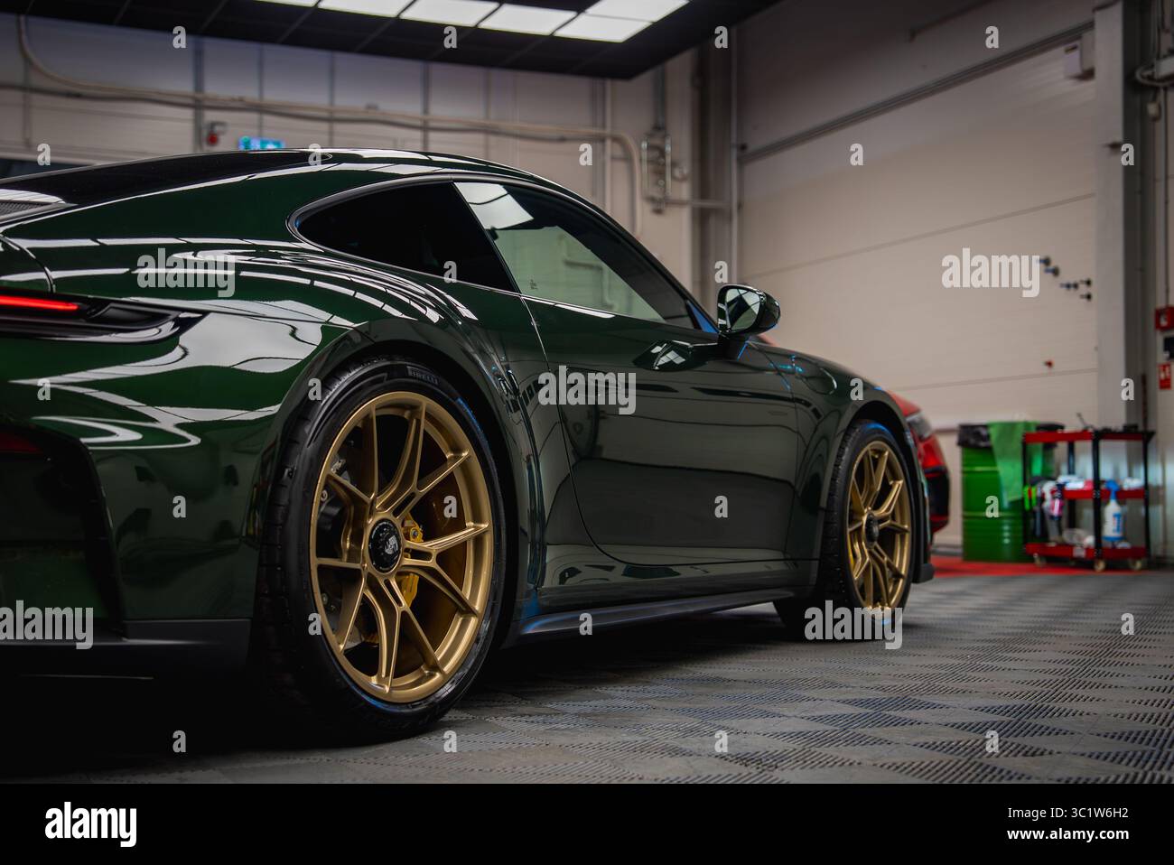 Dark Green Porsche 911 GT3 Touring in a Well Lit Tuning Garage Stock ...