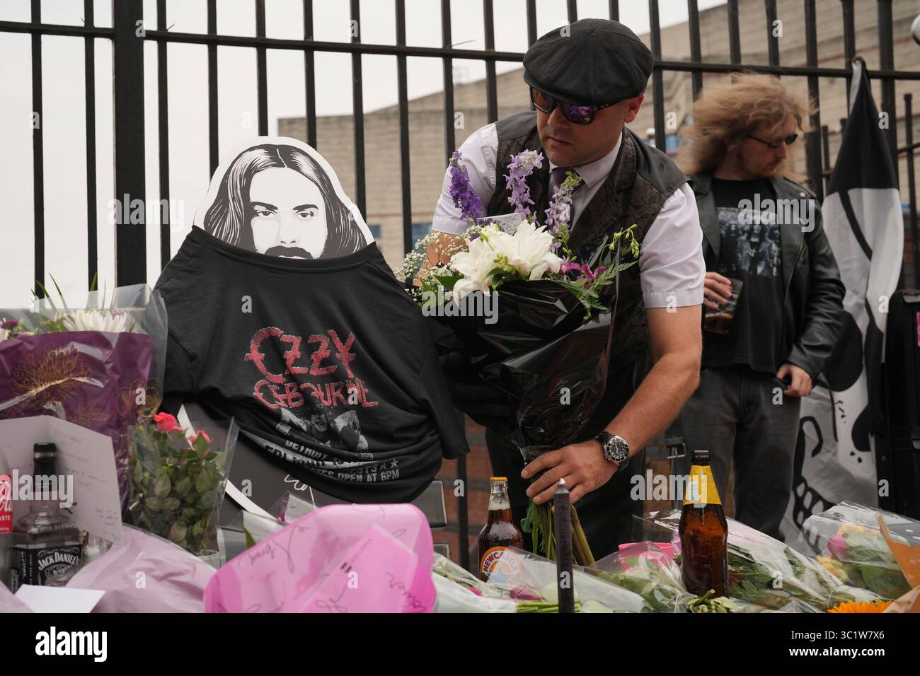 Flowers are left by fans to commemorate the death of Ozzy Osbourne at ...