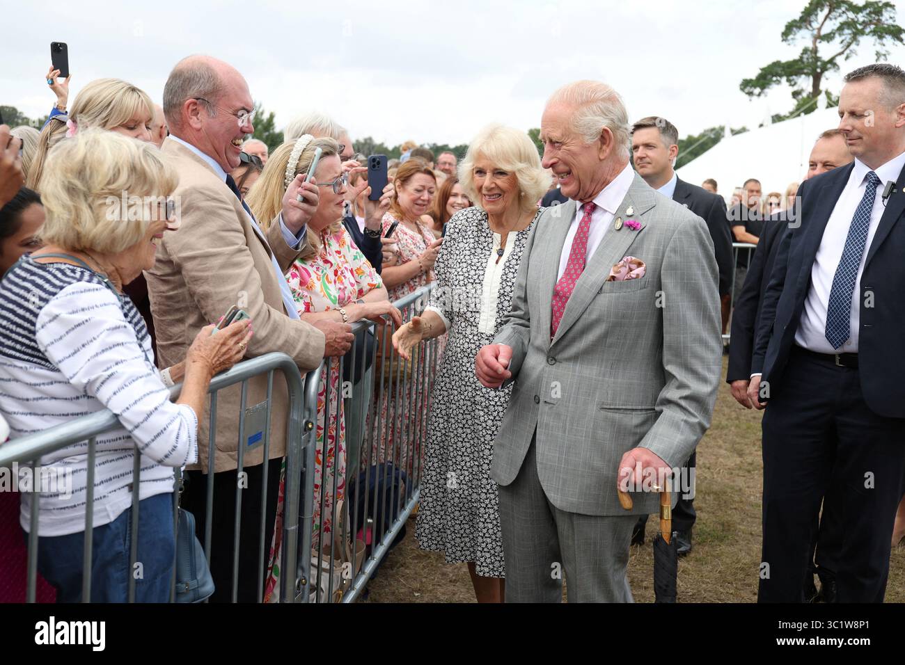 King Charles III and Queen Camilla meeting members of the public during ...