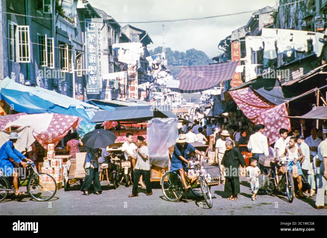 People at busy street market in Singapore, southeast Asia, c 1964 Stock ...