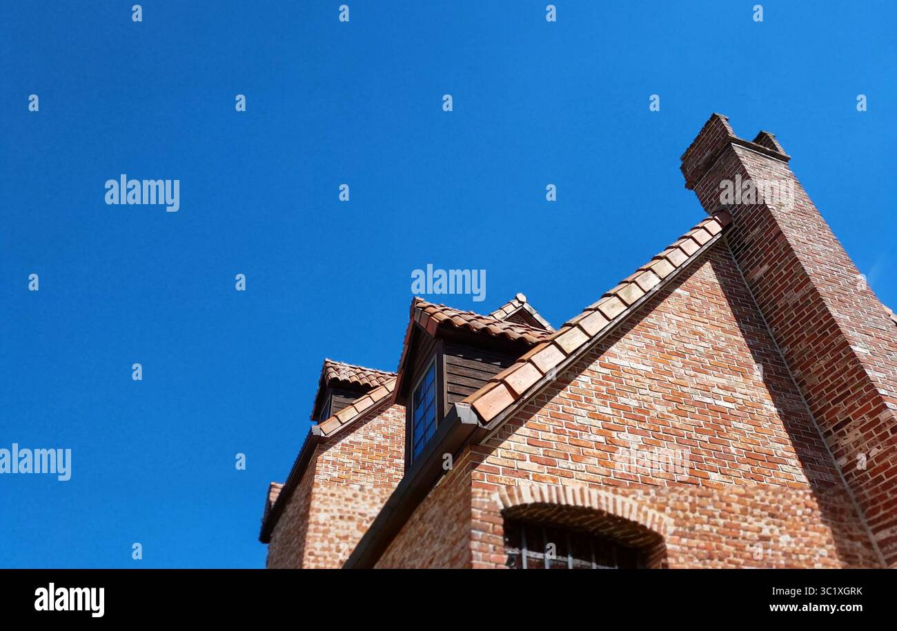 Charming Brick House Exterior Feature With Chimney and Gabled Roof ...