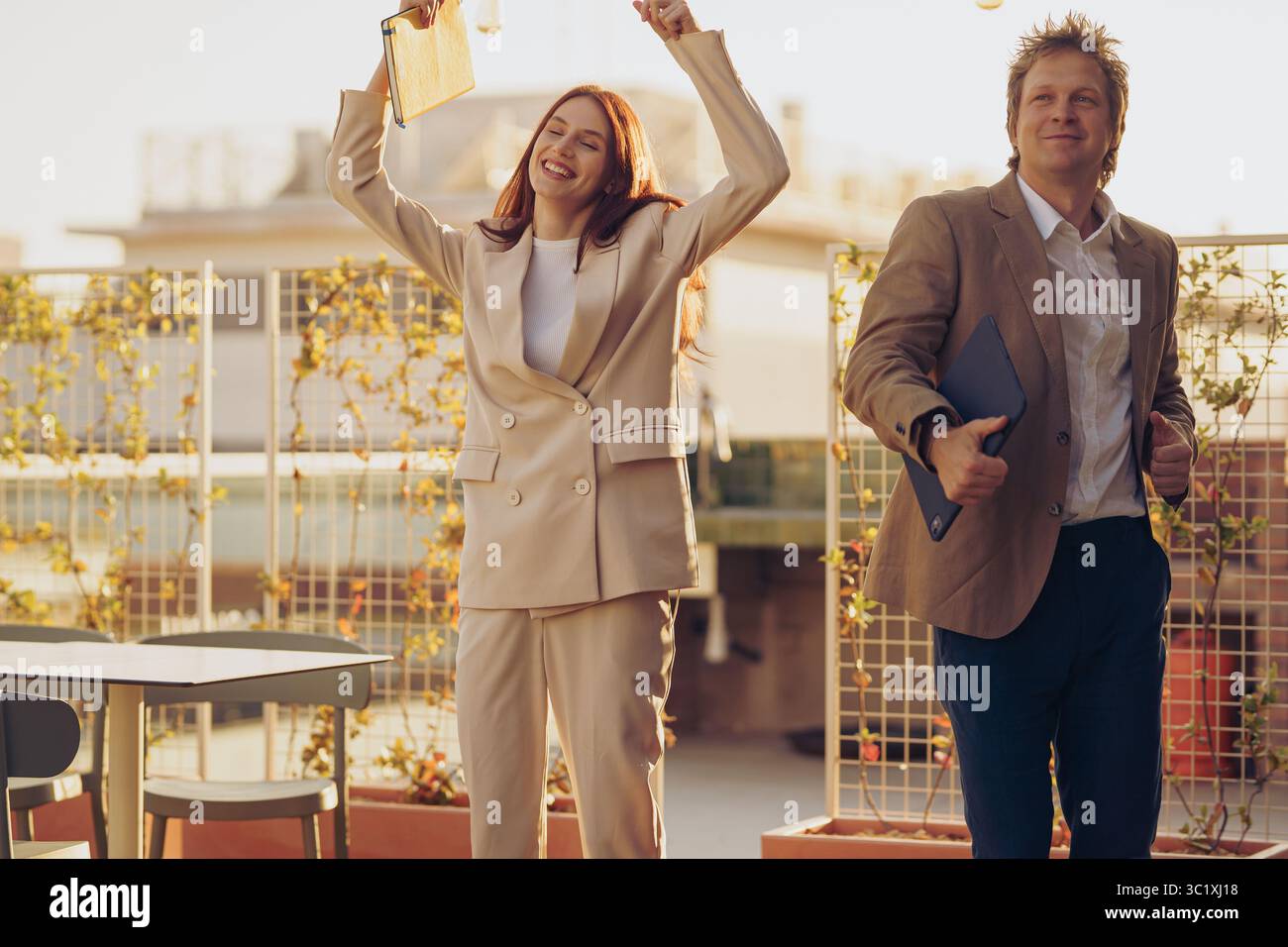 Dynamic business partners celebrating hi-res stock photography and ...