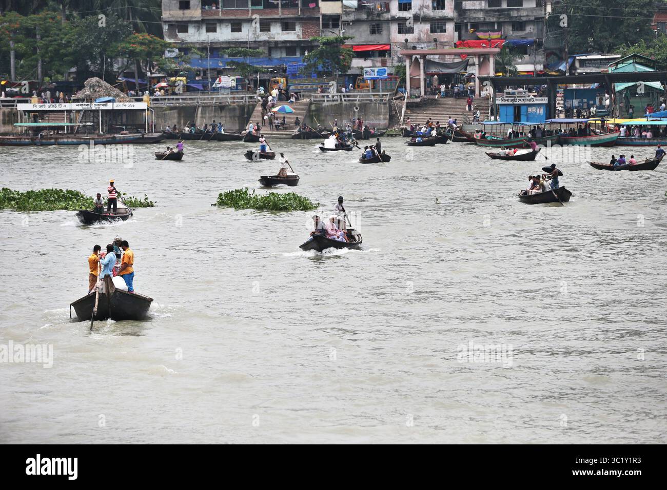 Dhaka, Bangladesh. 21st July, 2025. Boatmen ferry passengers across the ...