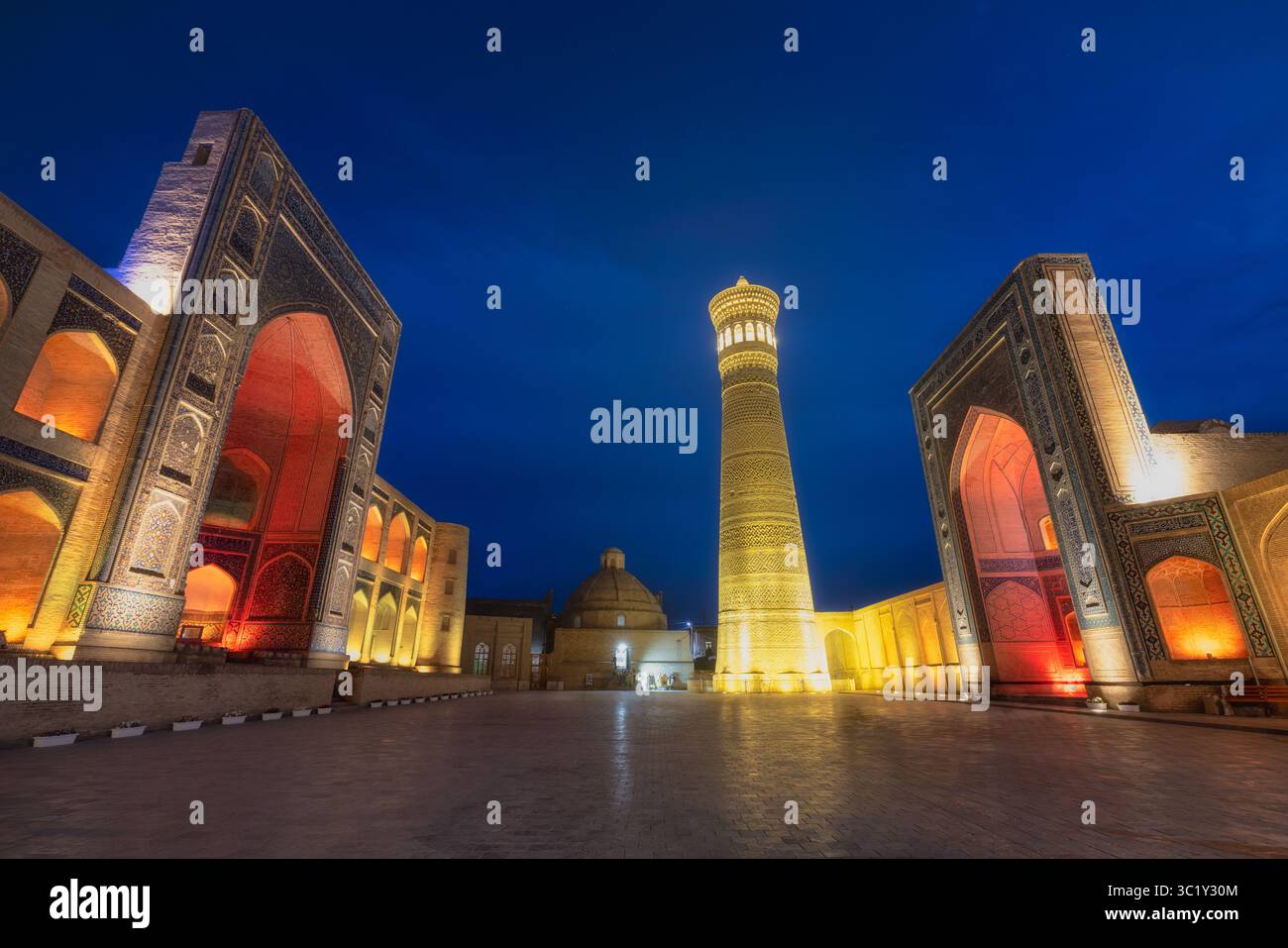 View of illuminated ancient structures flanking the towering Kalyan ...