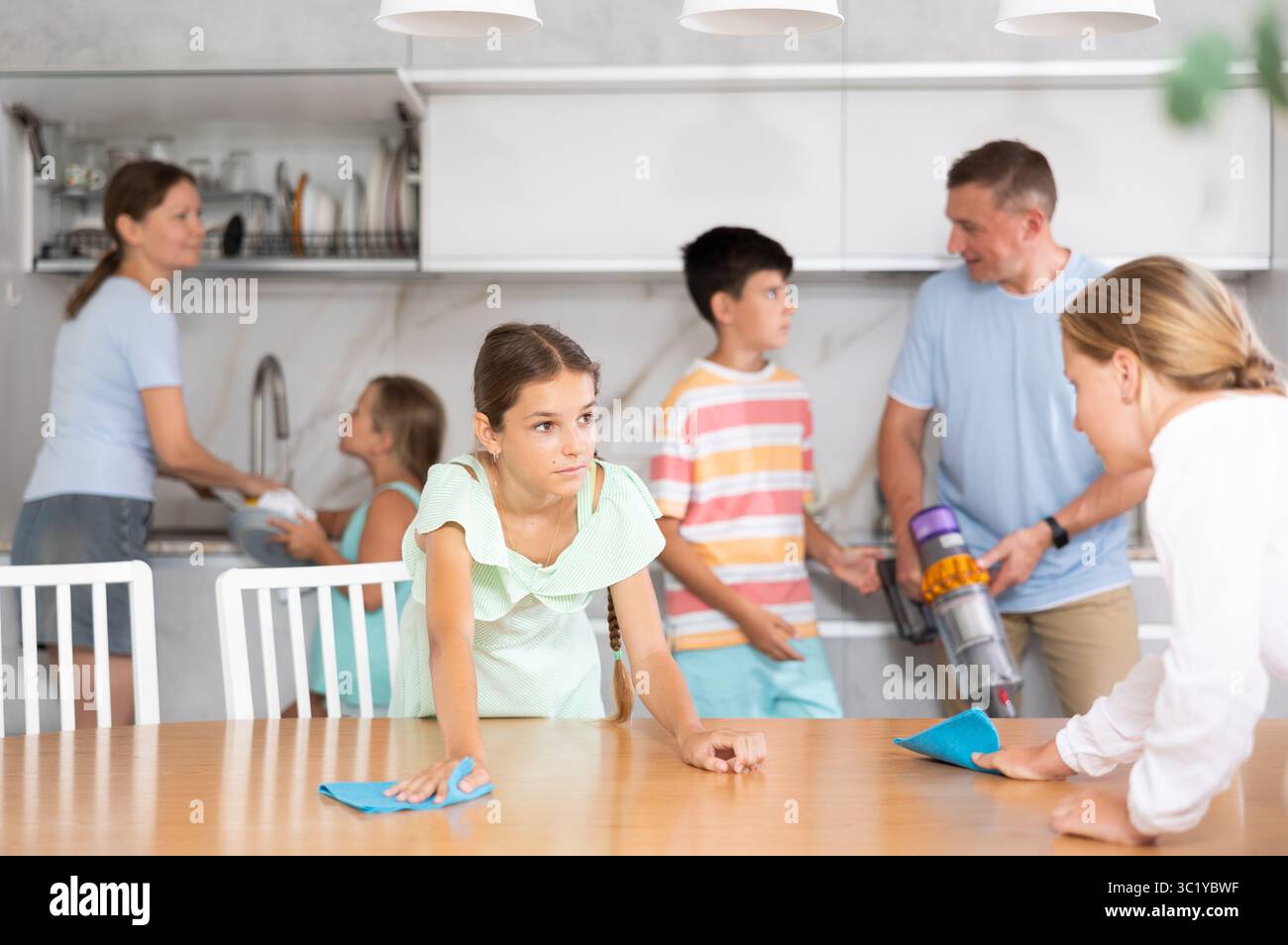 Big family members cleaning their house Stock Photo - Alamy