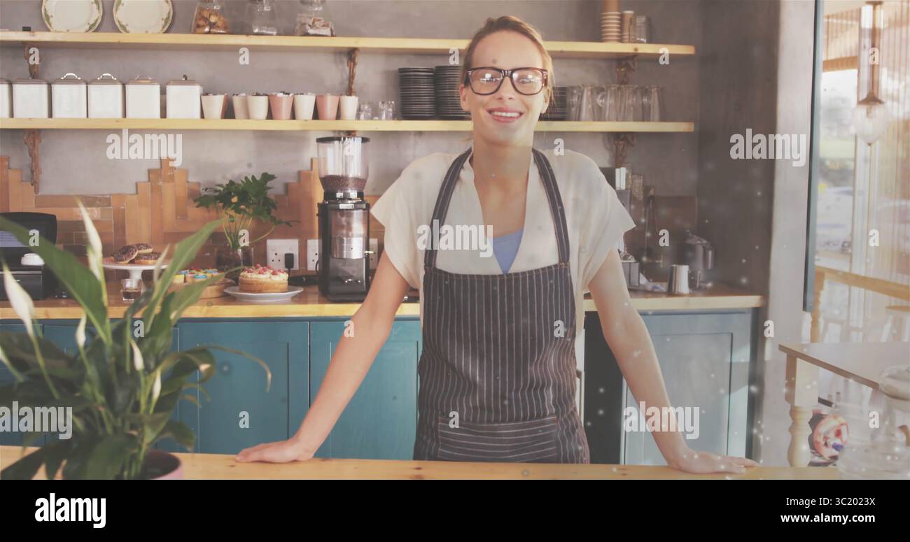 Standing woman wearing striped apron working behind wooden counter at ...
