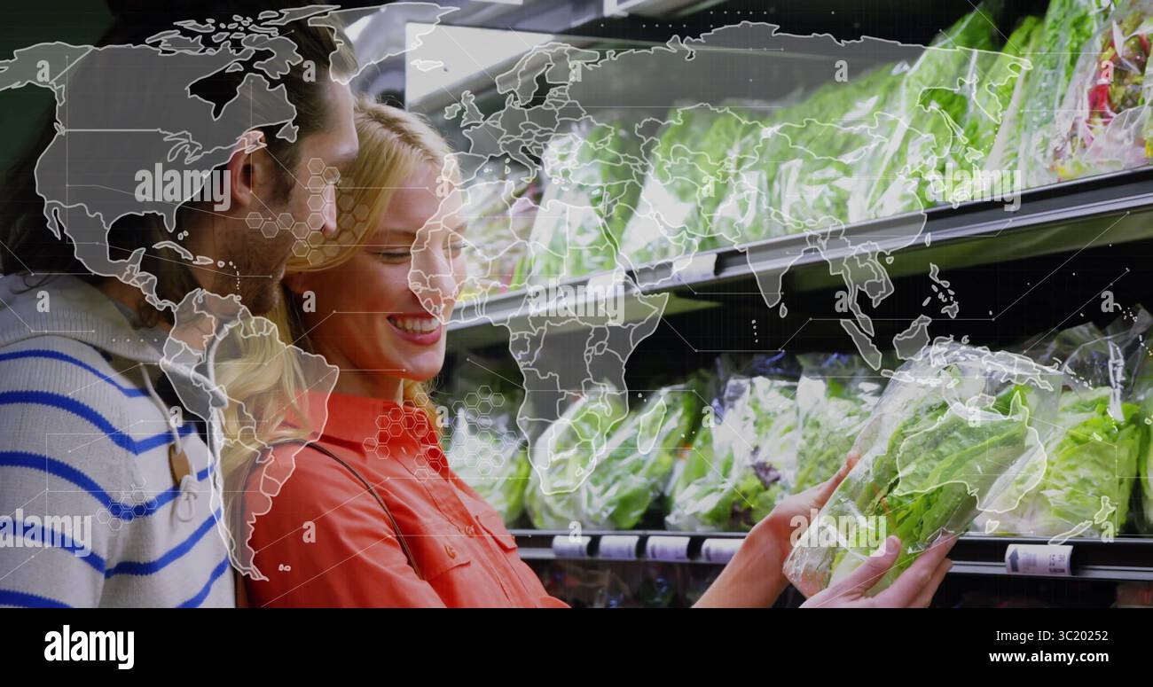 Selecting couple examining and choosing bagged lettuce in supermarket ...