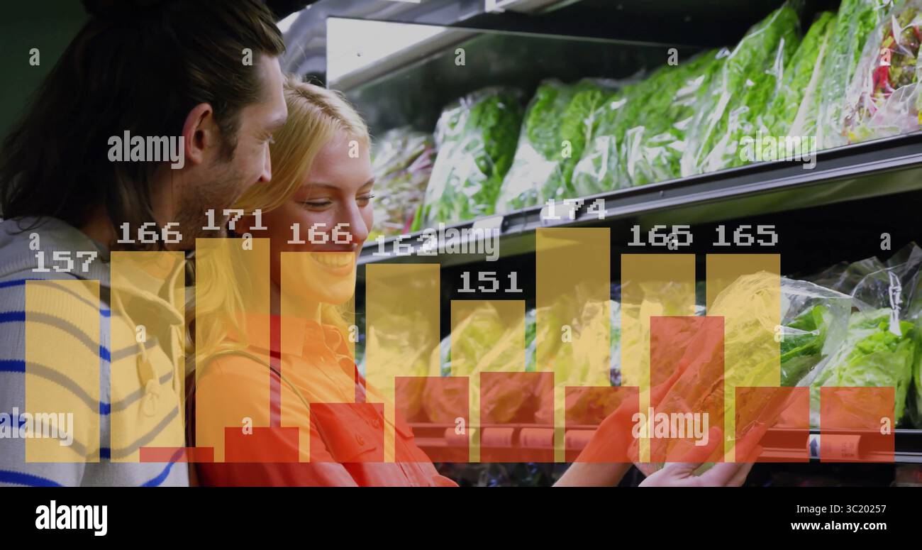 Grocery couple reading packaged greens label in supermarket produce ...