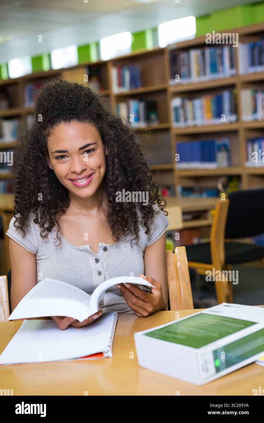 African american woman jotting notes hi-res stock photography and ...