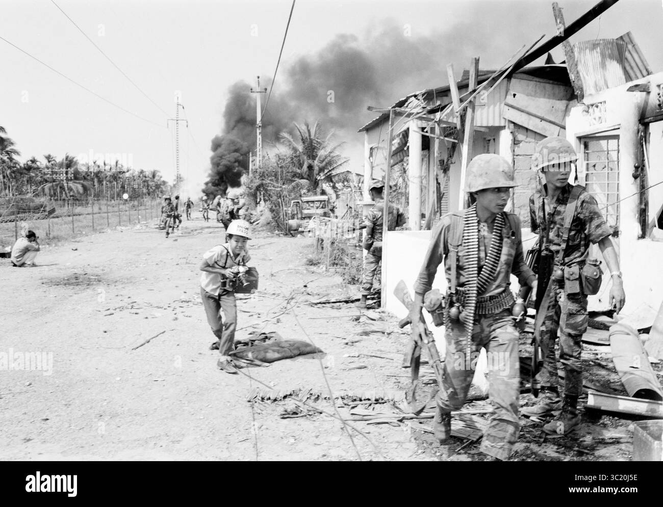 A 12-year-old photographer, left, follows Vietnamese marines into a ...