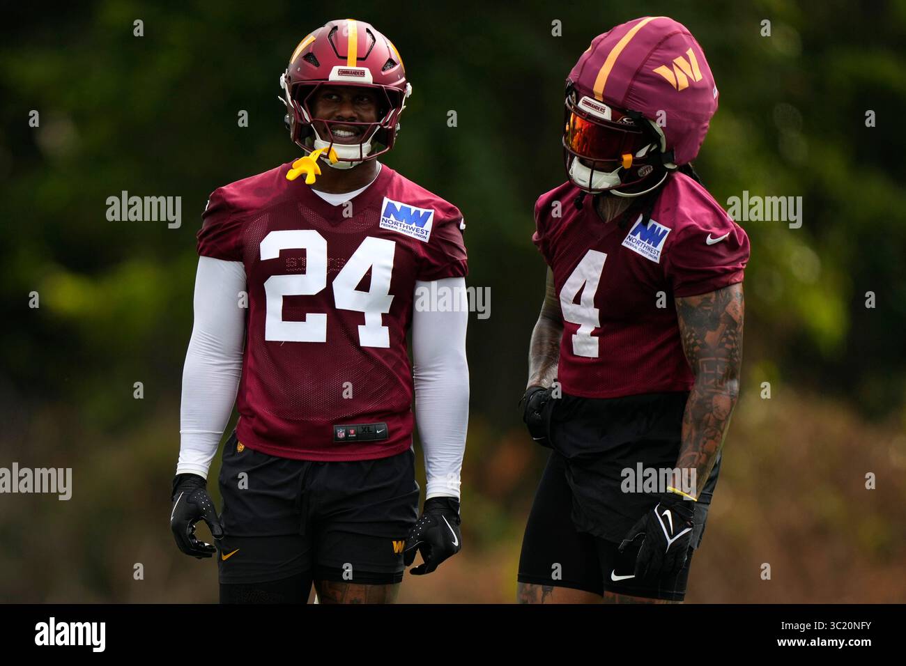 Washington Commanders linebacker Von Miller (24) talks with linebacker ...
