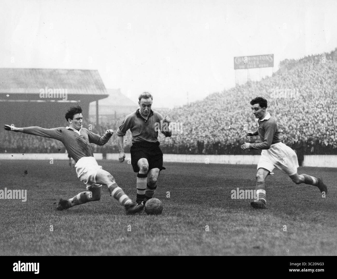Wolves captain Billy Wright in action against Derek Ufton and Cyril ...