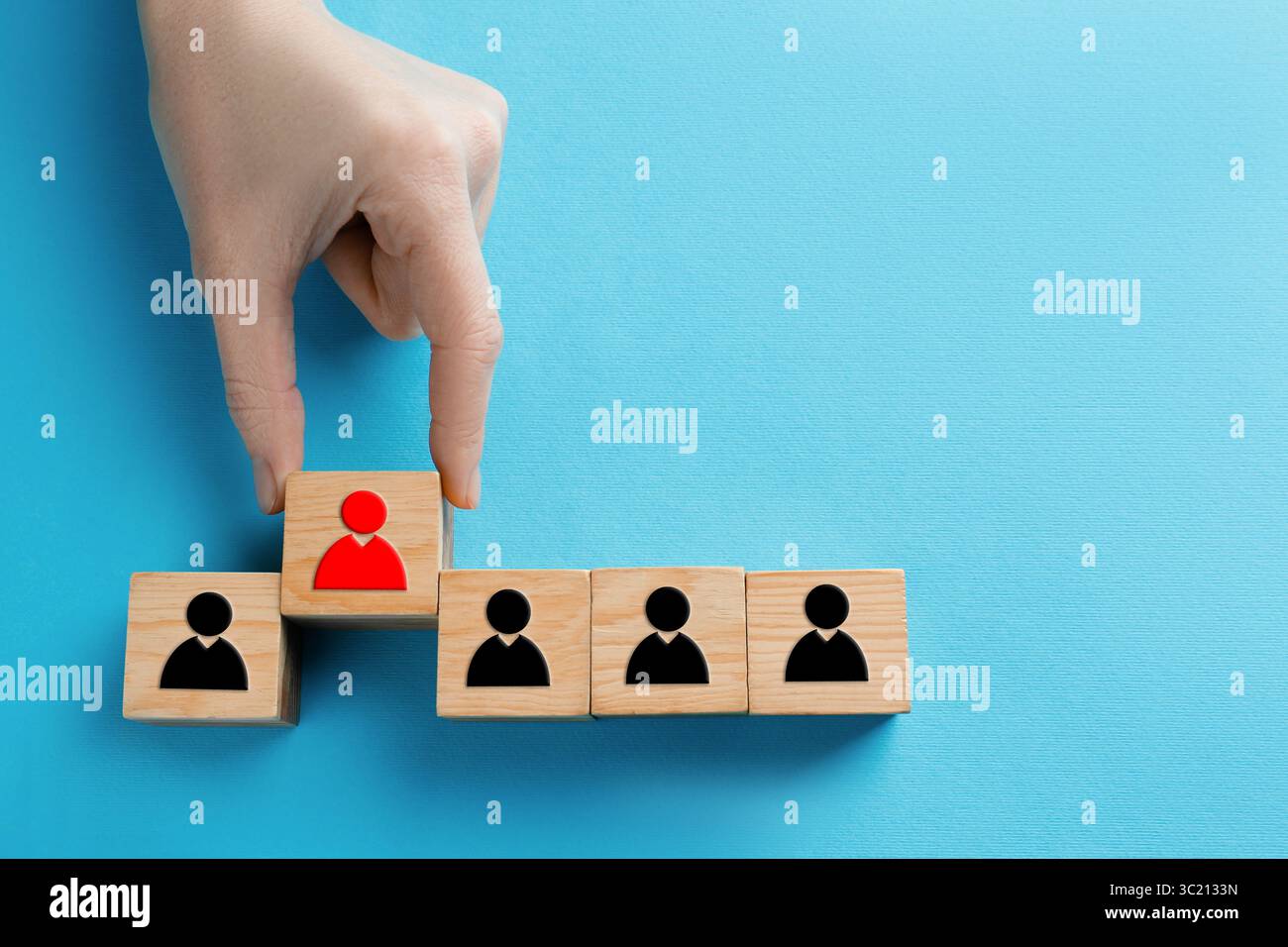 Dismissal. Woman taking cube with red human icon among others with ...