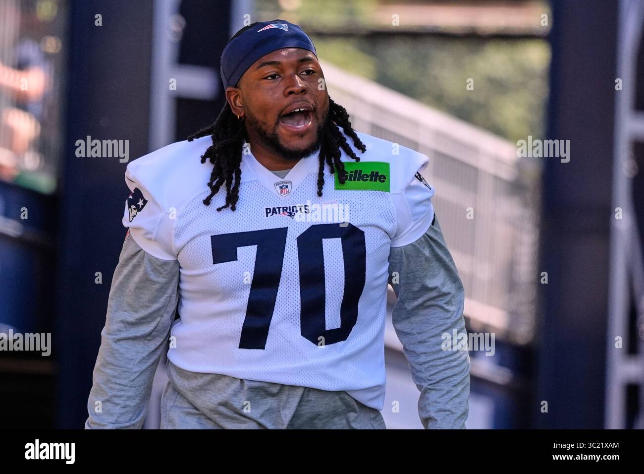 New England Patriots offensive tackle Caedan Wallace (70) heads to the ...