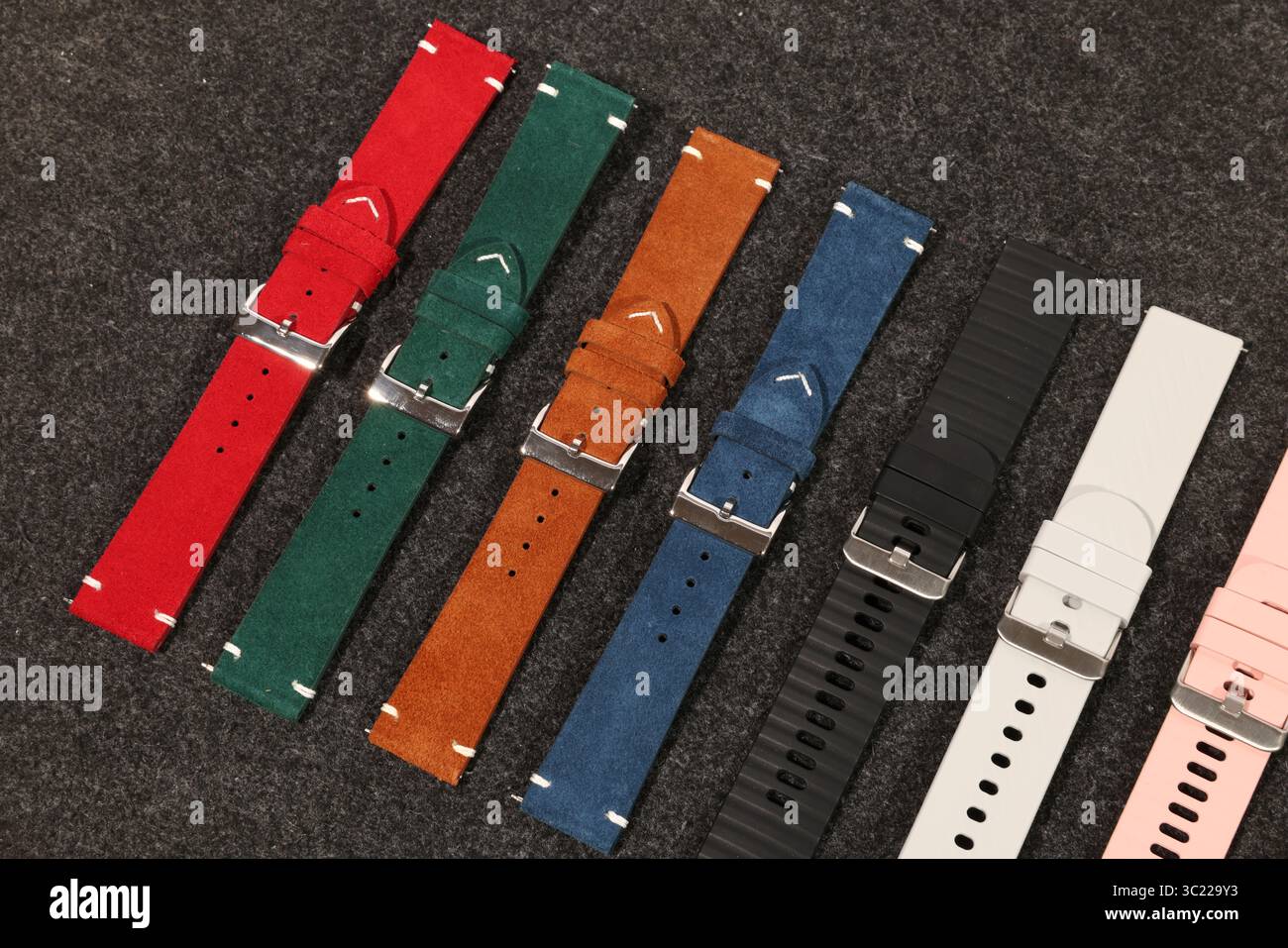 Colorful Watch Straps Collection Displayed on Dark Surface Stock Photo ...