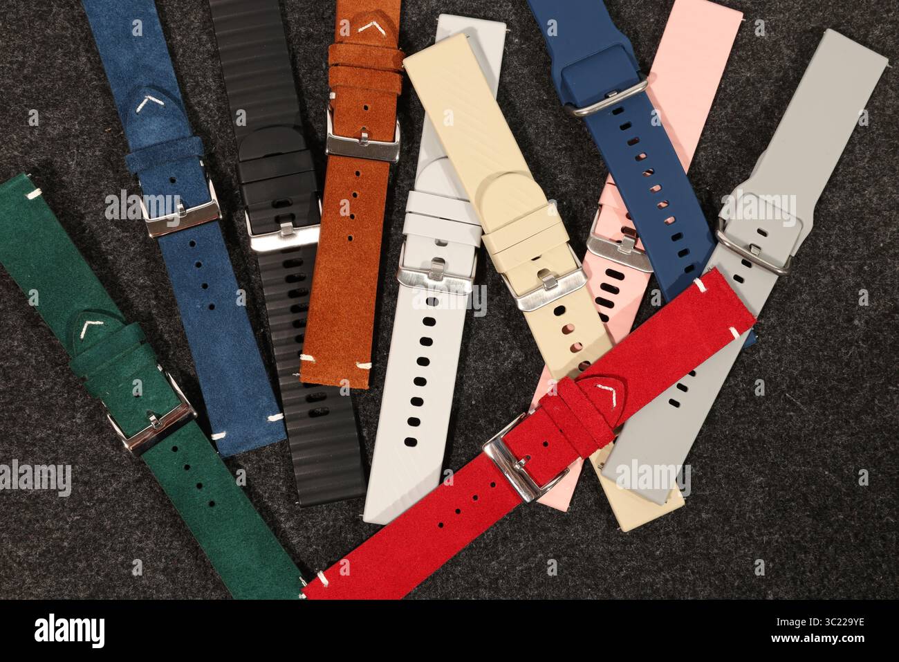 Colorful Watch Straps Collection Displayed on Dark Surface Stock Photo ...
