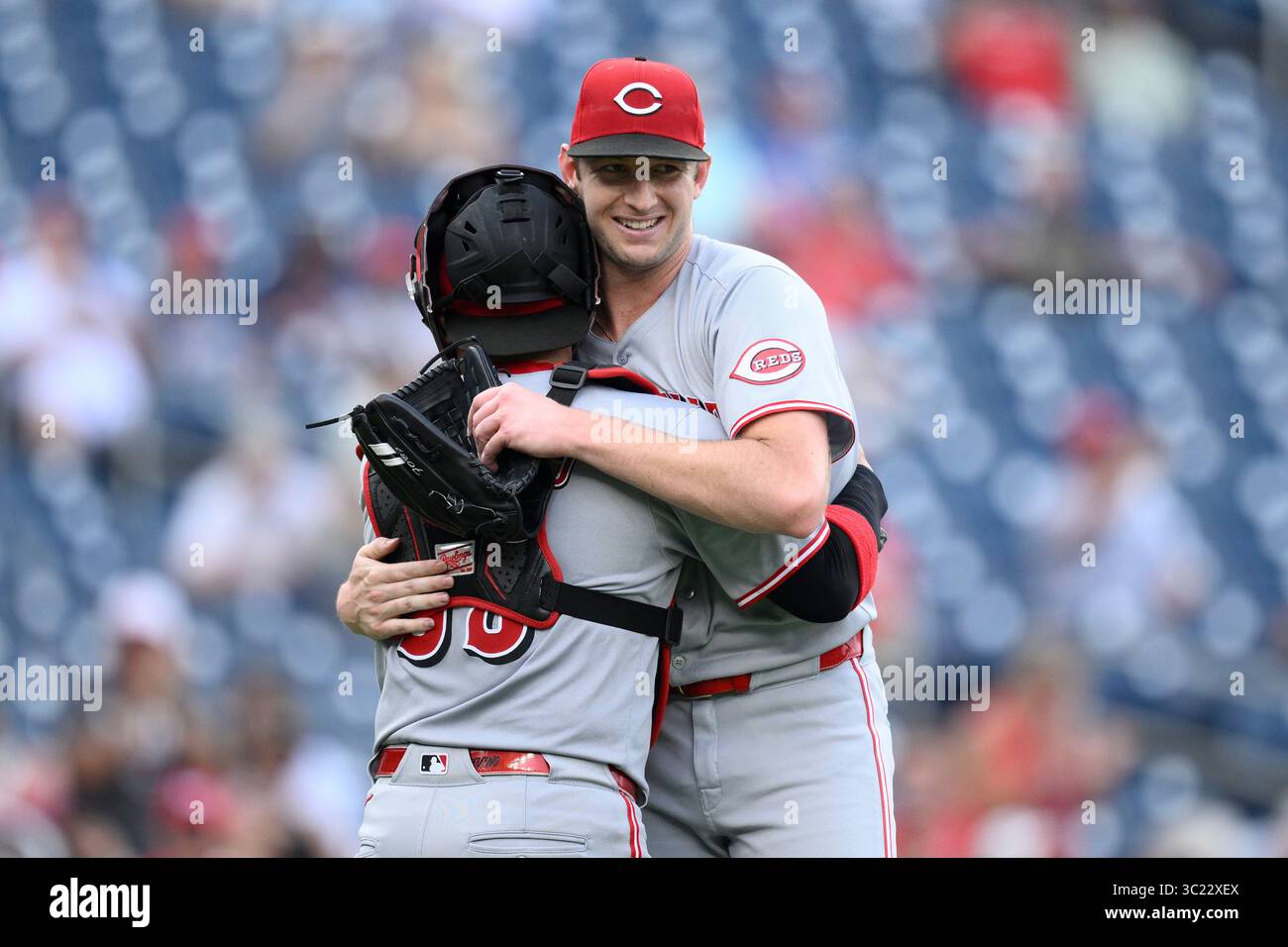 Cincinnati Reds starting pitcher Nick Lodolo, right, celebrates a ...