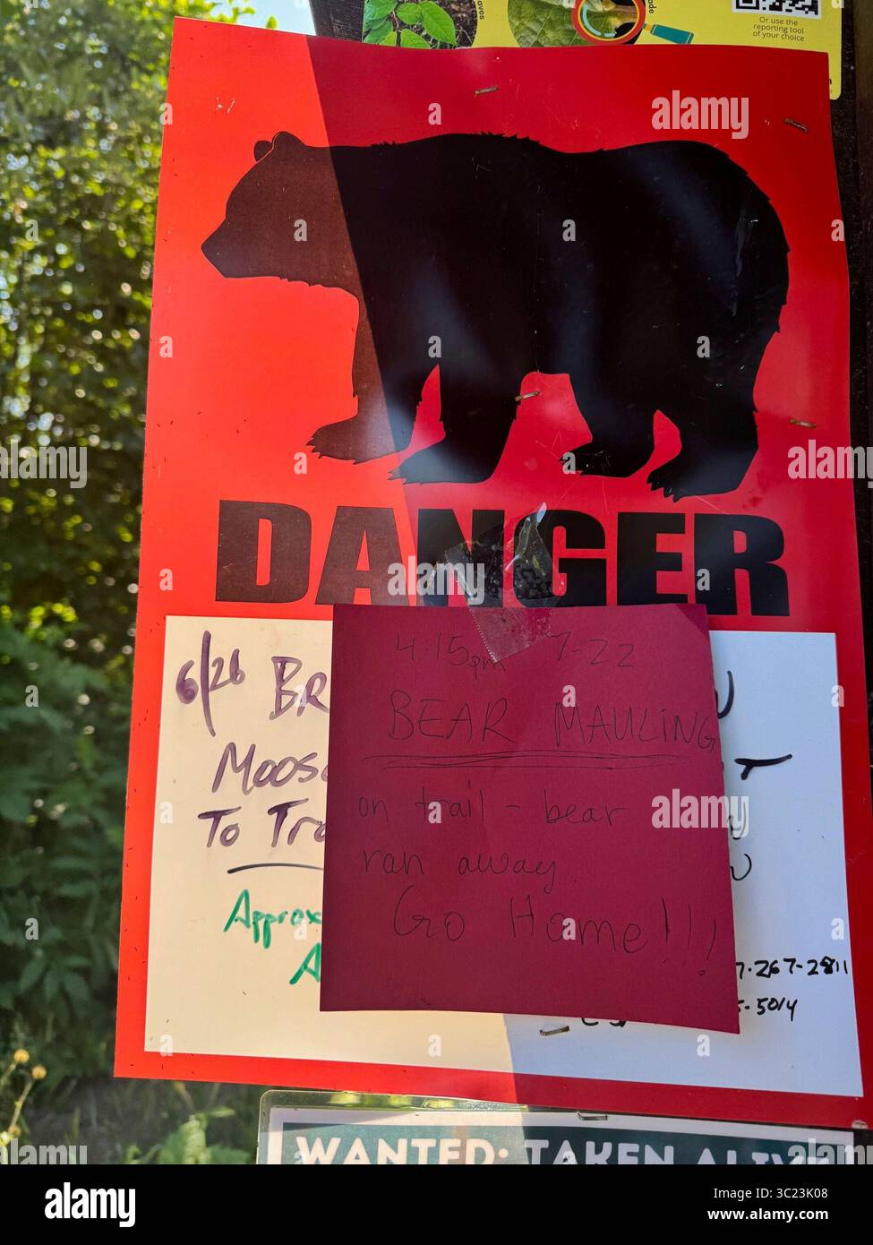 A bear warning sign is posted at the Basher trailhead in Anchorage ...
