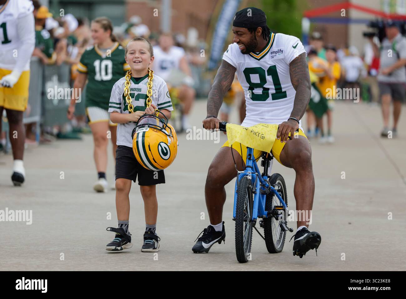 Green Bay Packers' wide receiver Julian Hicks rides a bike to an NFL football practice Wednesday ...