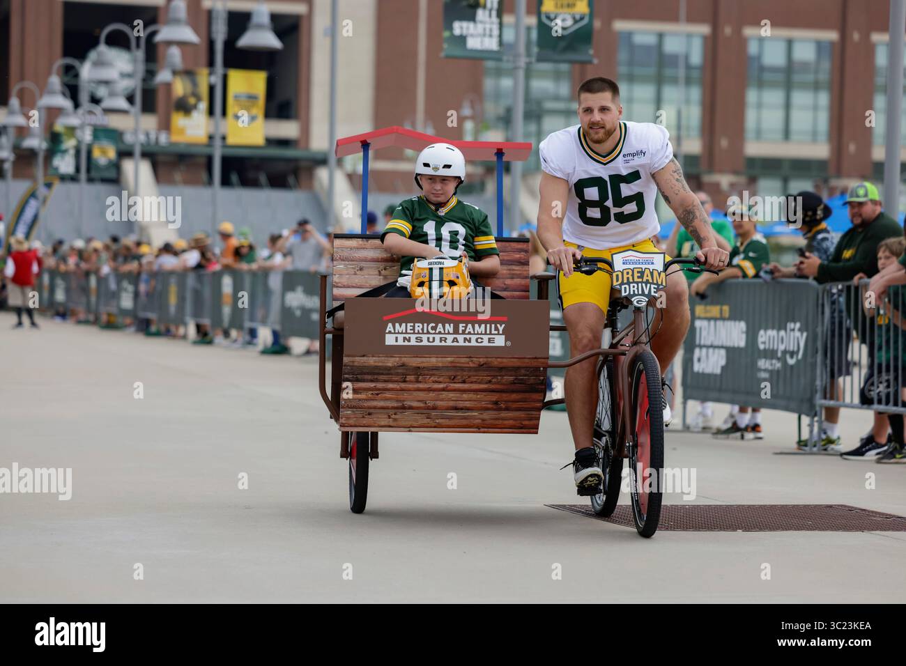 Green Bay Packers' tight end Tucker Kraft rides a bike to an NFL ...