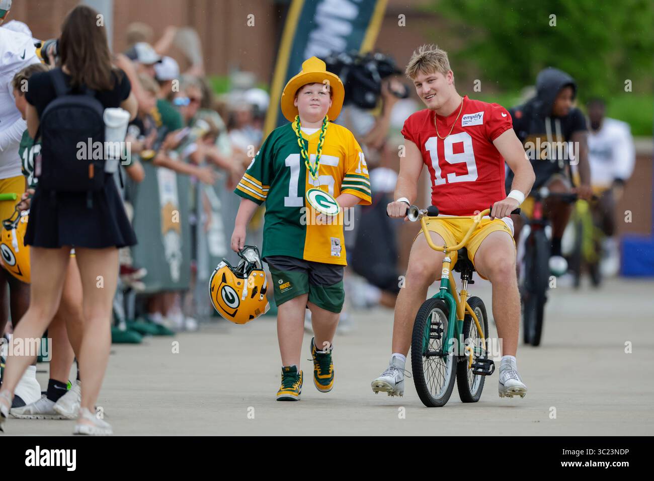 Green Bay Packers' quarterback Taylor Elgersma rides a bike to an NFL ...