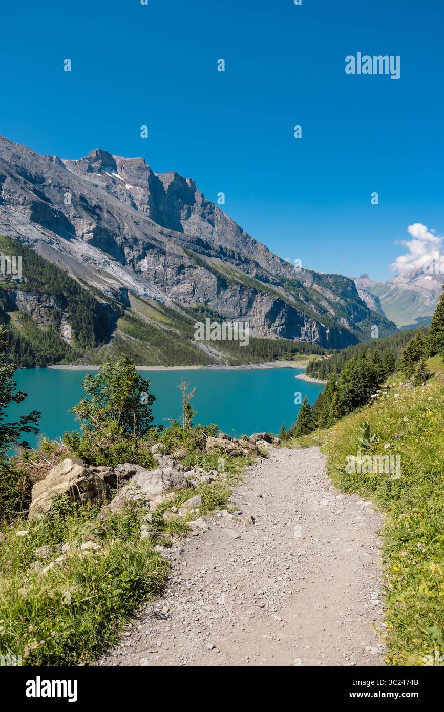 Swiss mountains: Nestled deep in the Bernese Alps, Lake Oeschinen in ...