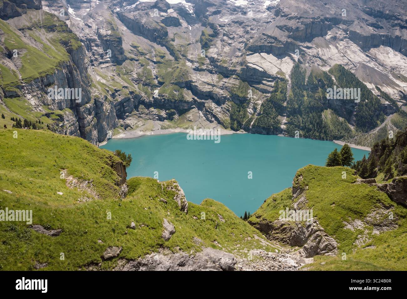 Swiss mountains: Nestled deep in the Bernese Alps, Lake Oeschinen ...