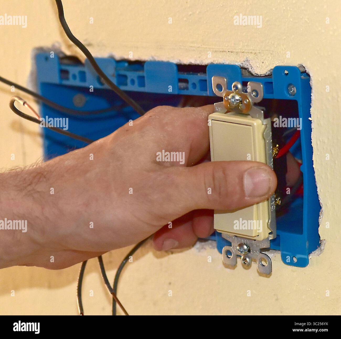 Electrician installs wiring on hi-res stock photography and images - Alamy