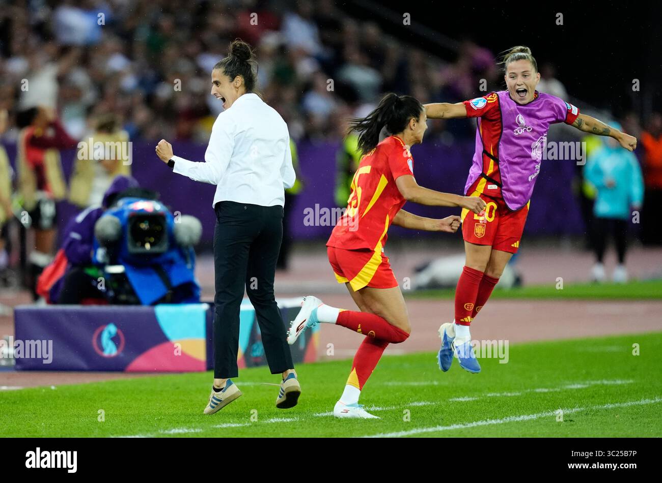 Spain manager Montse Tome celebrates with Spain's Leila Ouahabi (centre ...