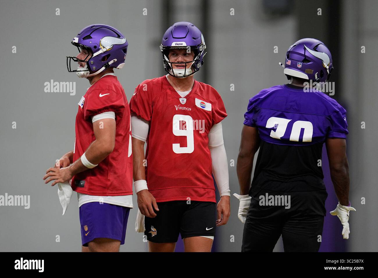 Minnesota Vikings quarterbacks Sam Howell (8), J.J. McCarthy (9) and ...