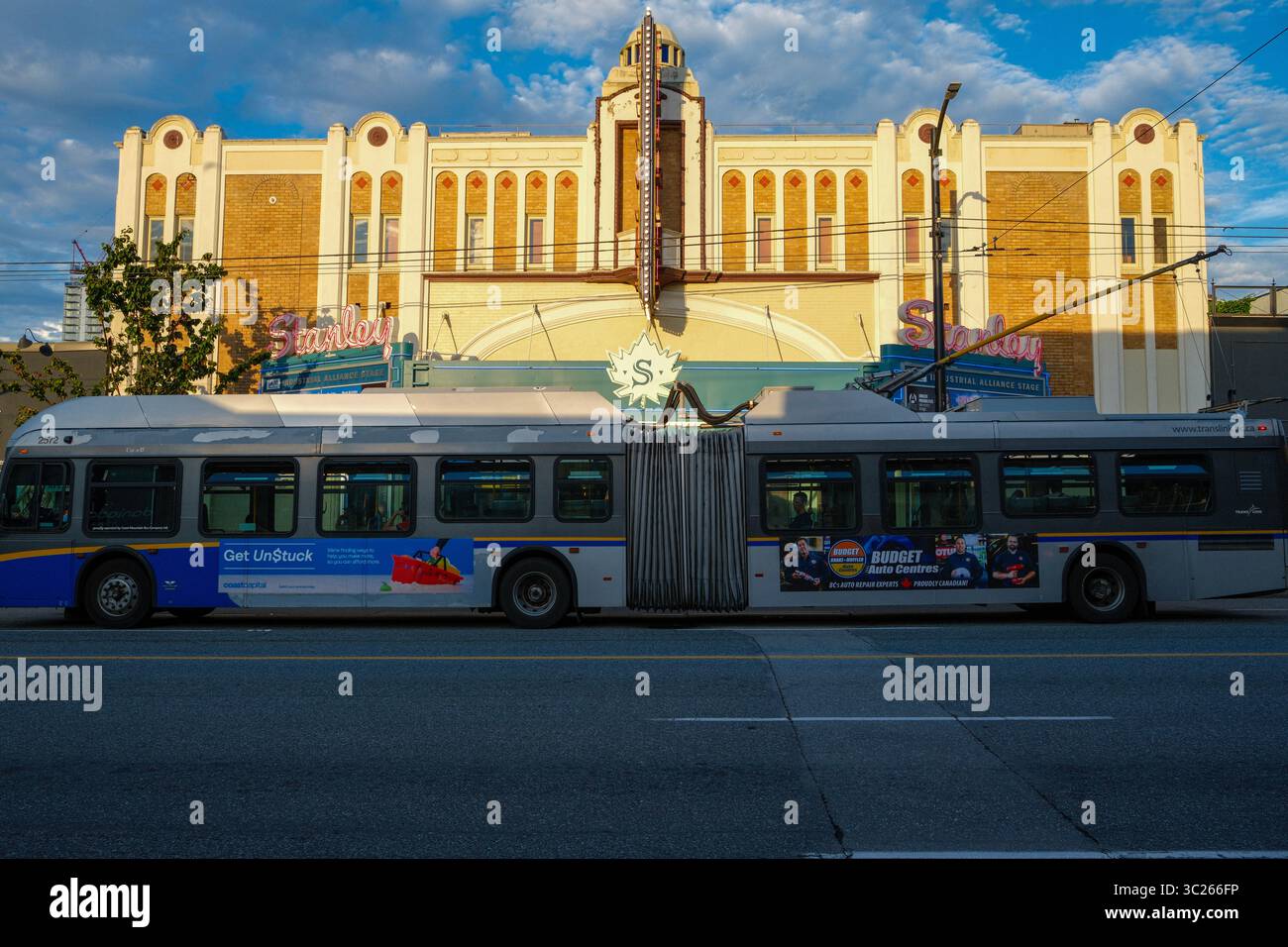 A Translink bus is stopped in front of the Stanley Theatre, now known ...