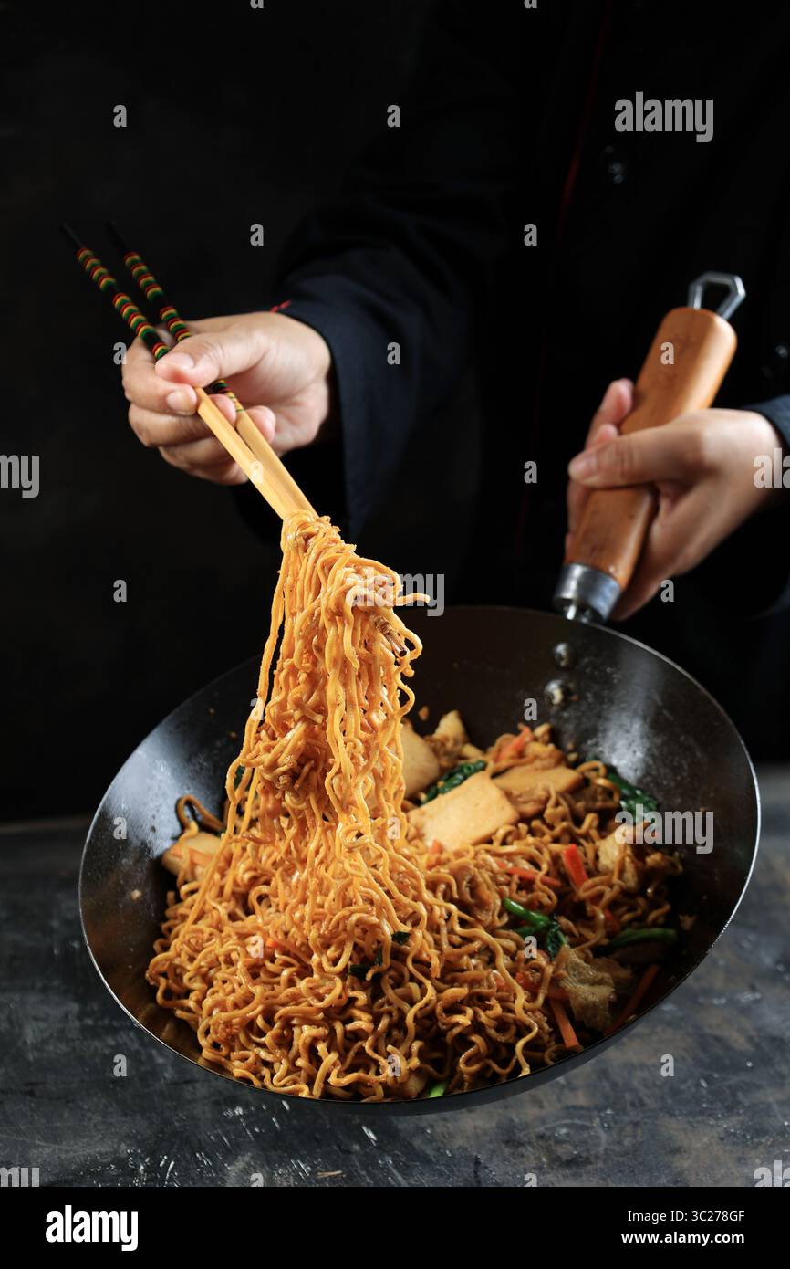 Chinese chef hand using hi-res stock photography and images - Alamy