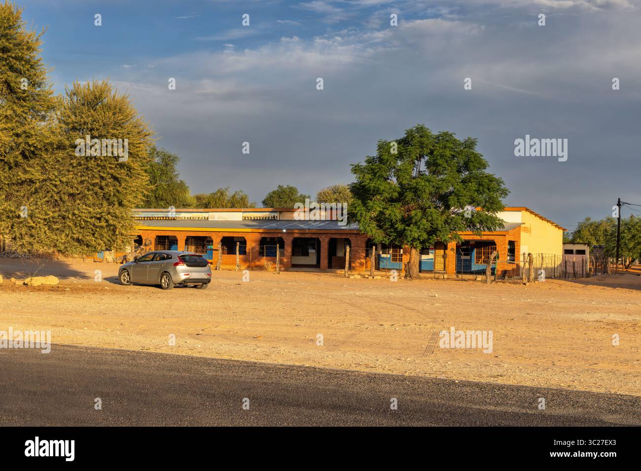 spaza african shop general dealer by the side road cars stopping for ...