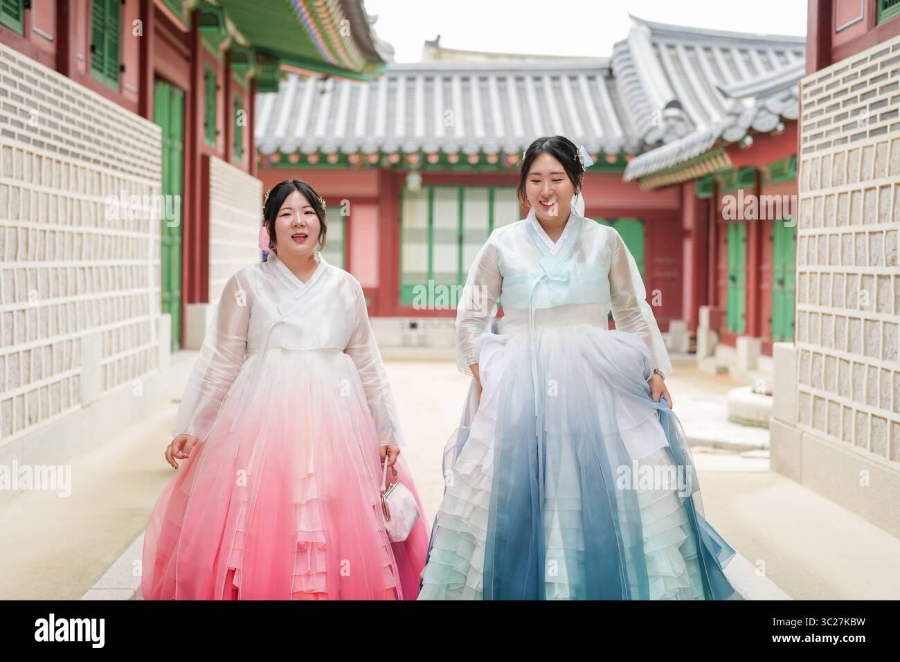Seoul, June 2025: Two Korean women in their twenties stroll through ...