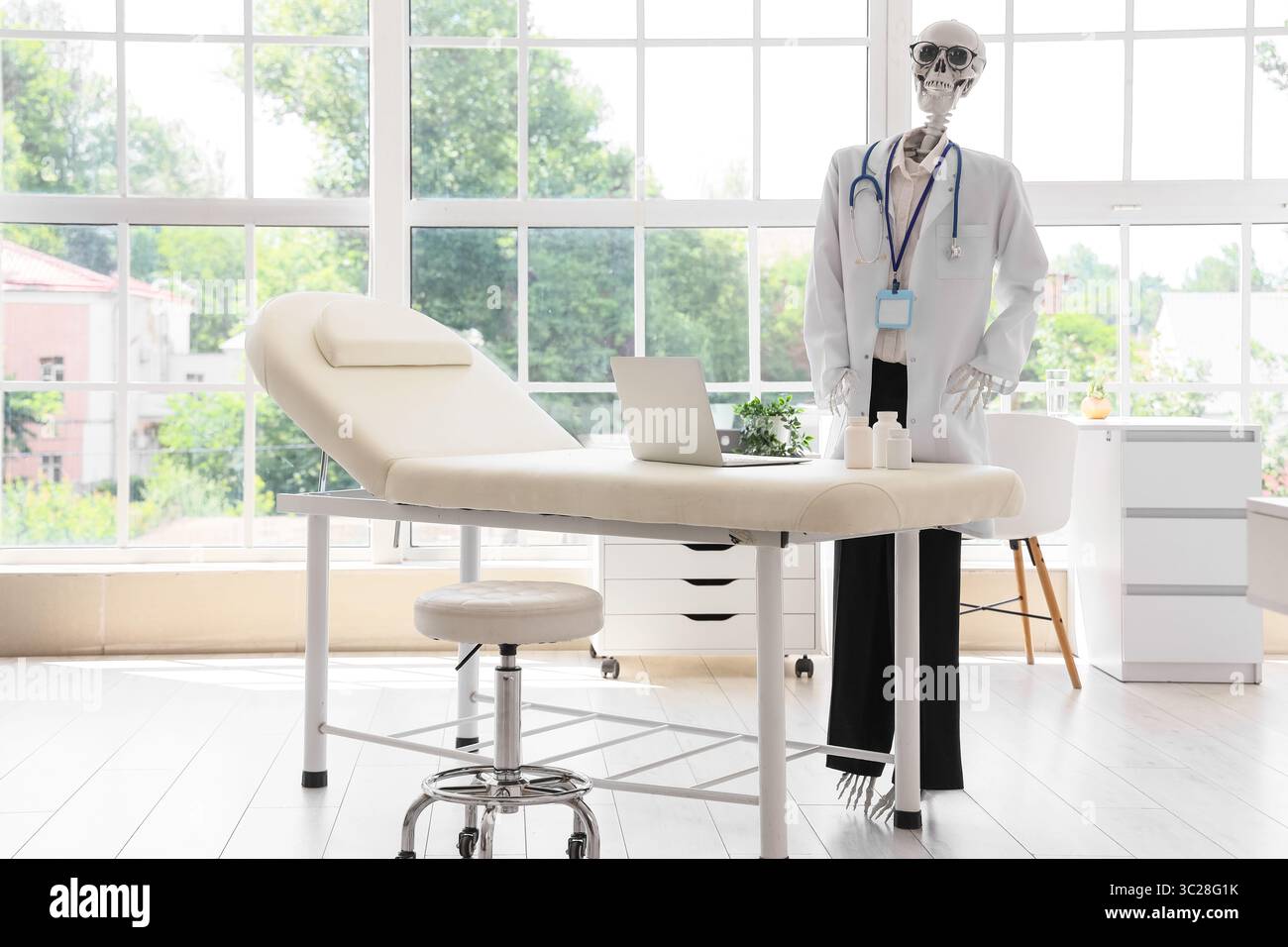 Human skeleton model with doctor's uniform in medical office Stock ...